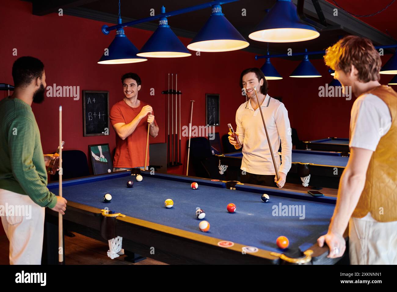 Friends gather around a pool table, laughing and enjoying a casual game ...