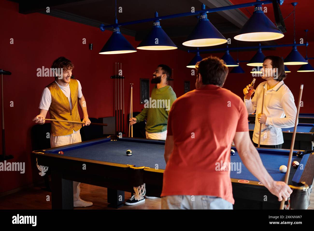 Friends enjoy a night of billiards and laughter in a dimly lit pool ...