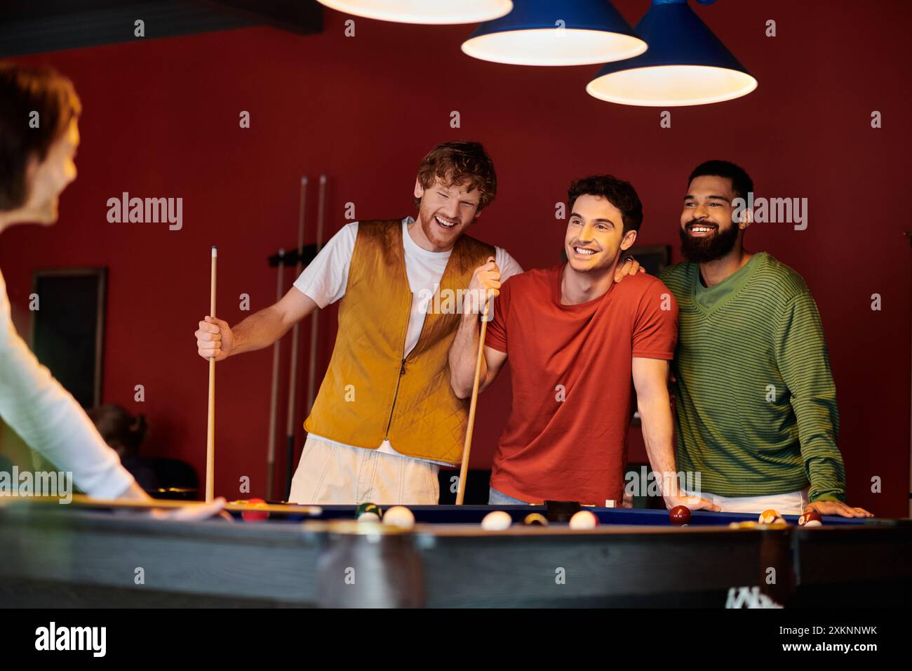 Friends play billiards in a casual setting Stock Photo - Alamy