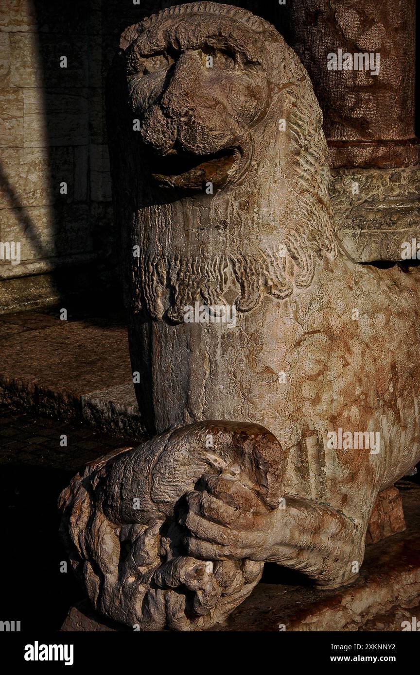 One of two sculpted lions flanking the Romanesque north porch of the ...