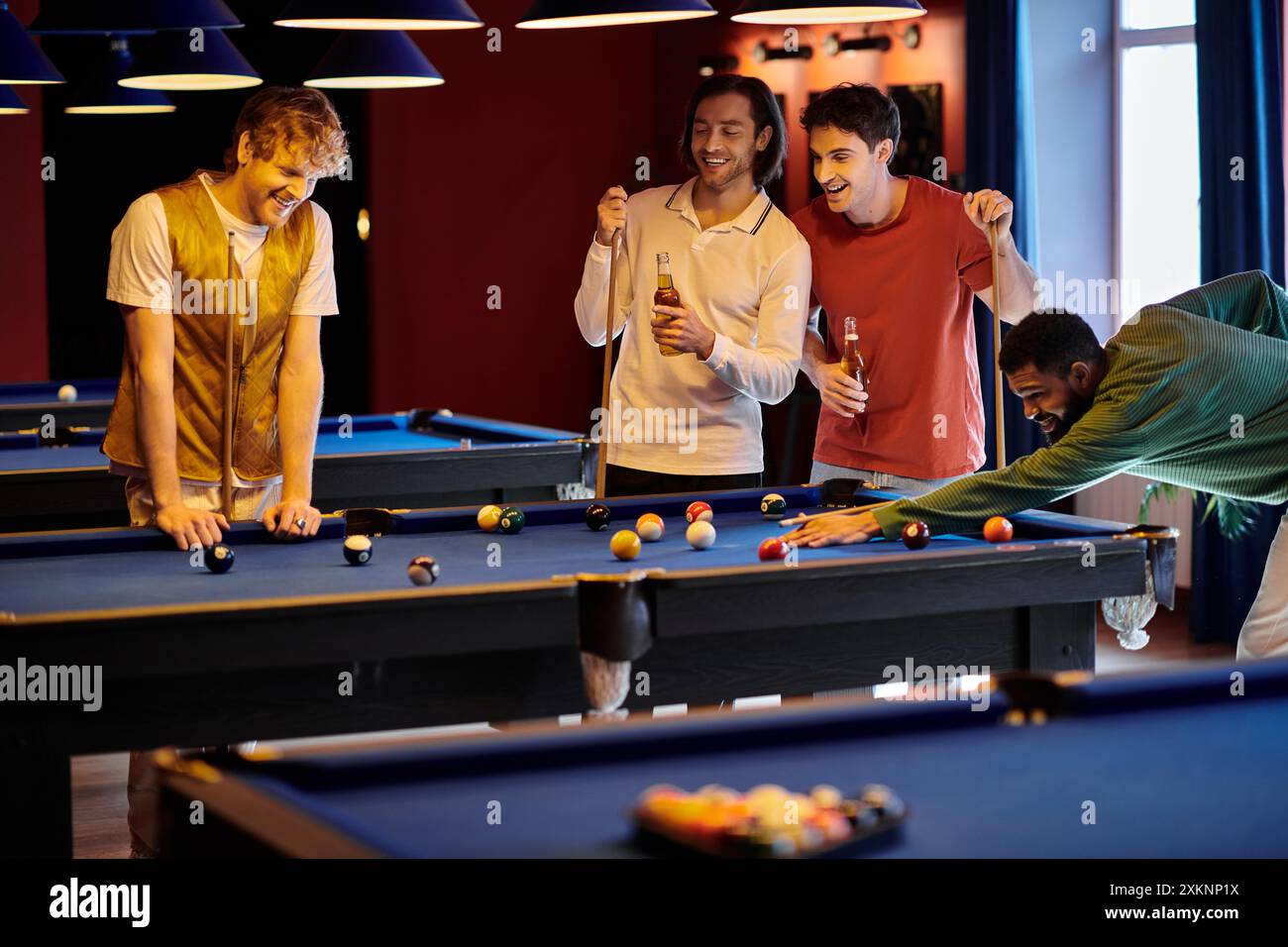 Friends enjoy a casual game of billiards in a dimly lit room Stock ...