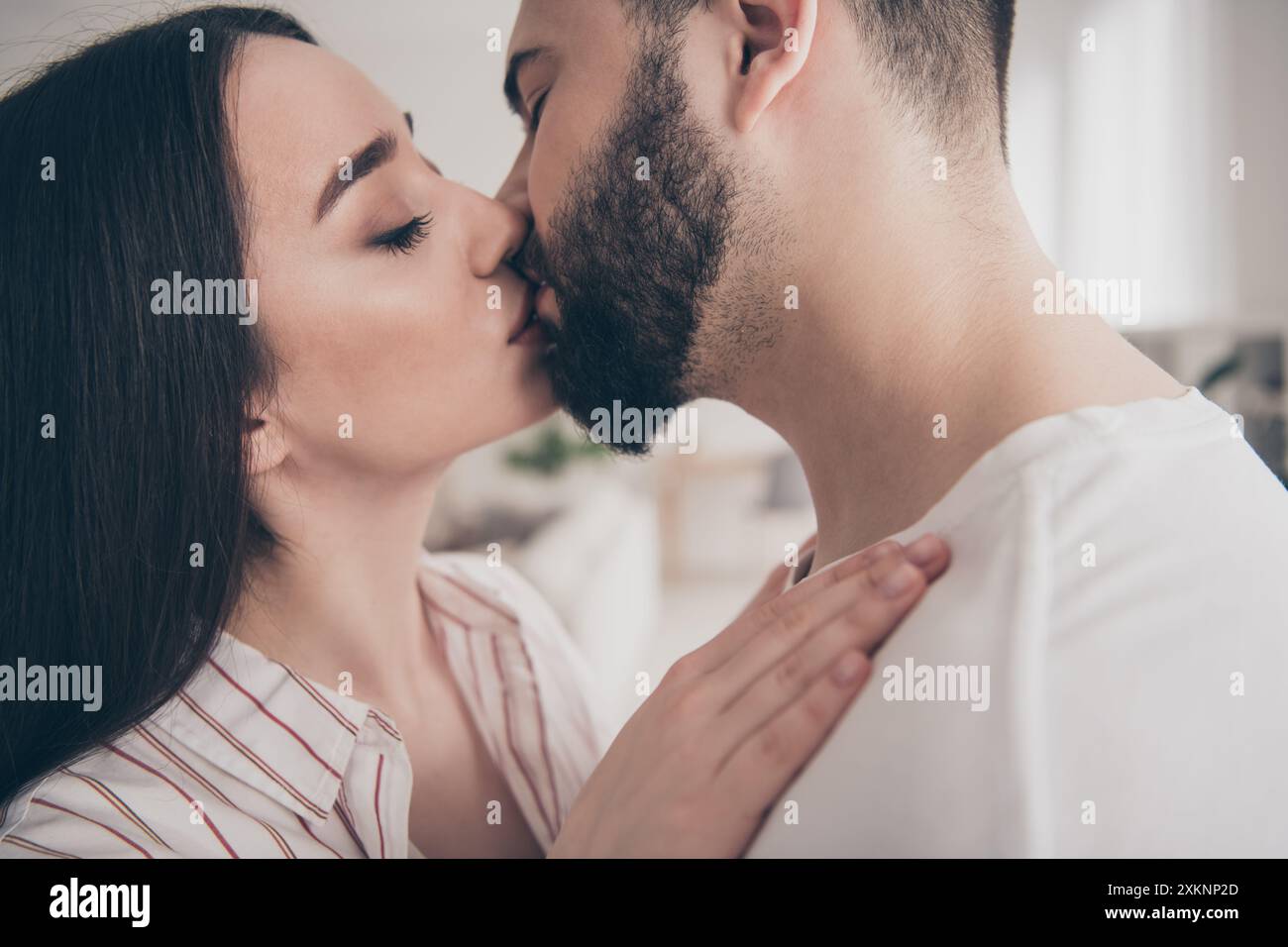 Photo of attractive trendy cheerful married young couple kissing lips spending free time move ...