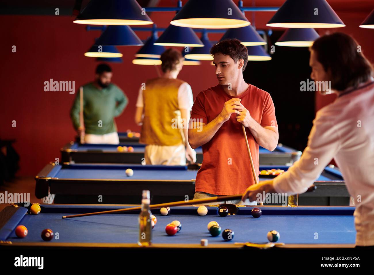 Friends gathered at a pool hall, enjoying a friendly game of billiards ...