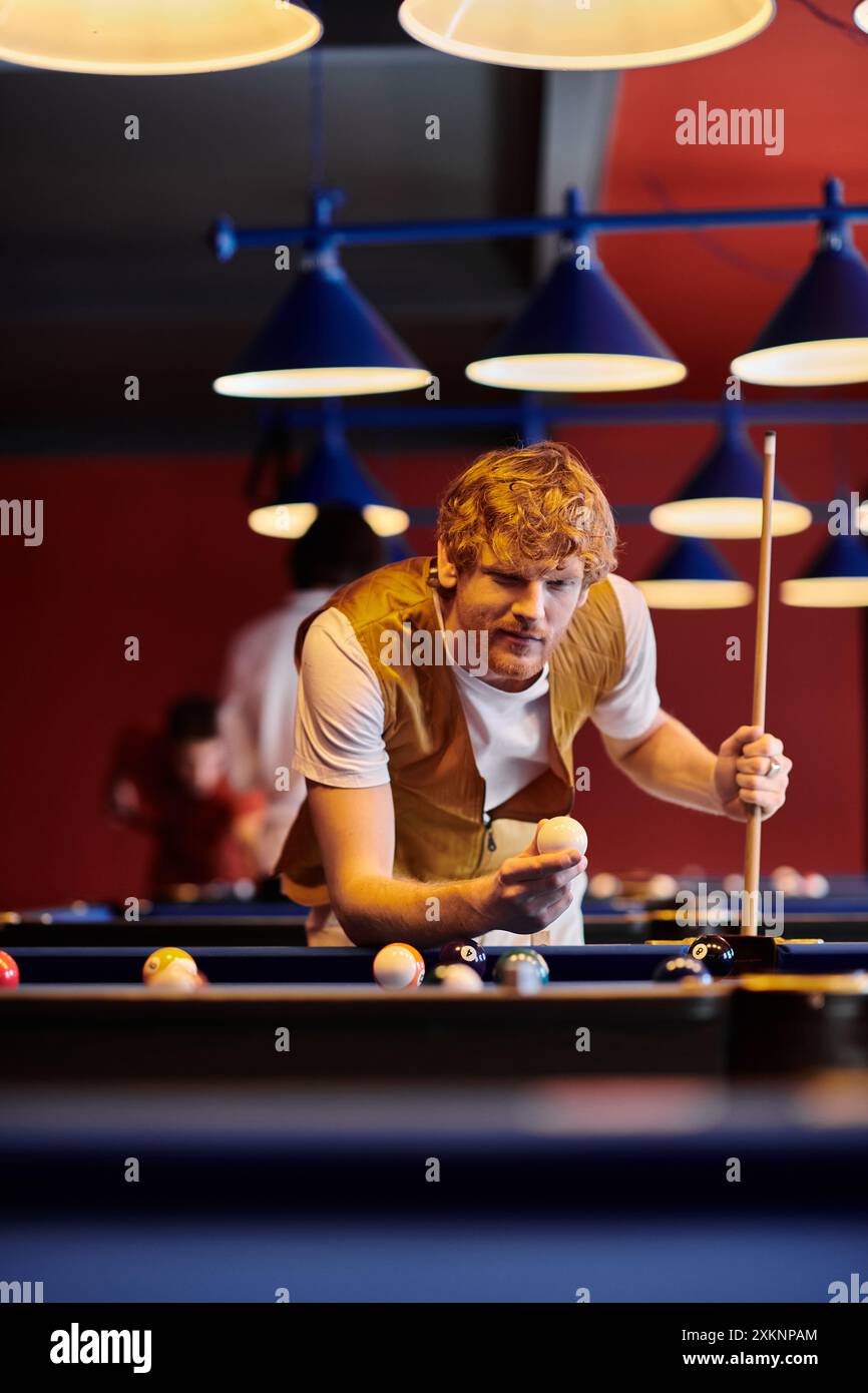 A group of friends gather for a friendly game of billiards in a dimly ...