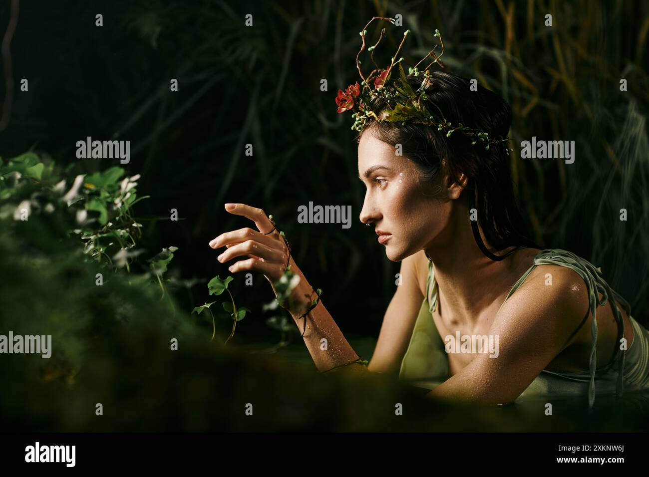A woman in a floral crown reaches out towards a swamp, surrounded by ...