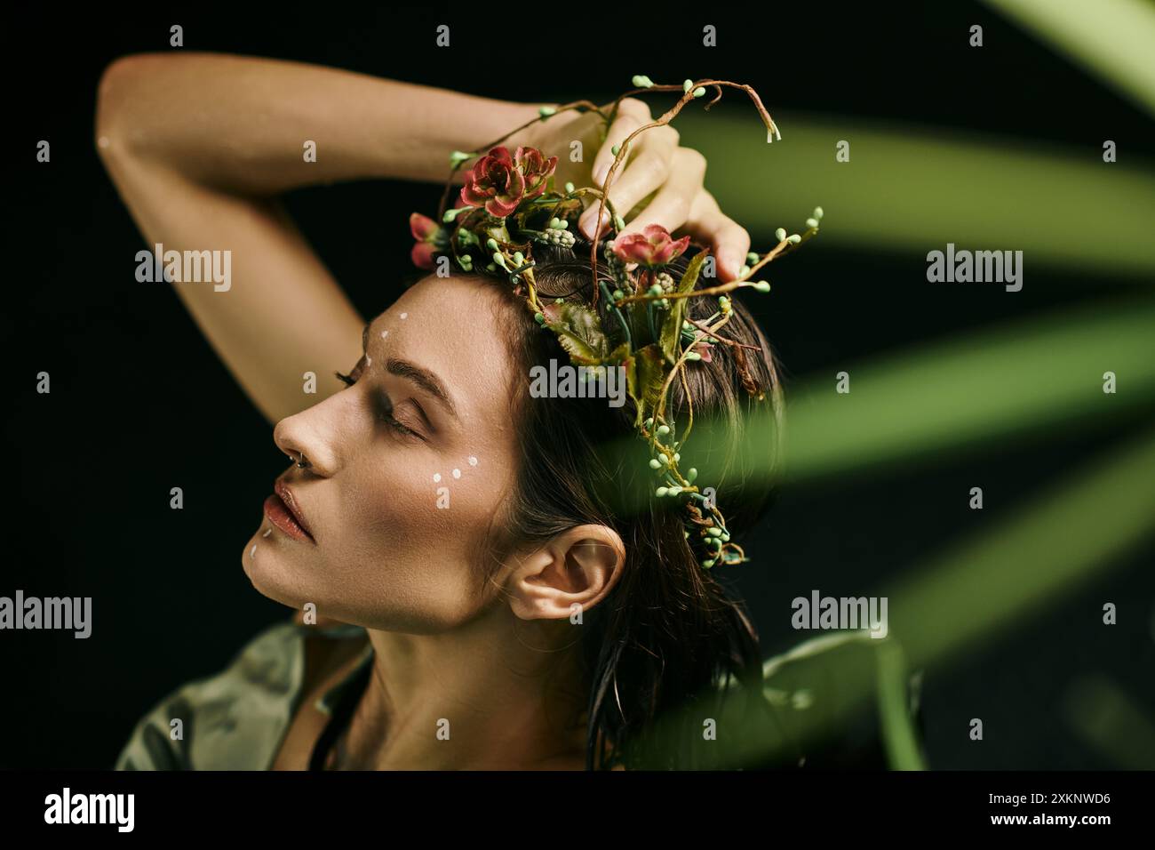 A woman wearing a floral crown poses near a swamp Stock Photo - Alamy