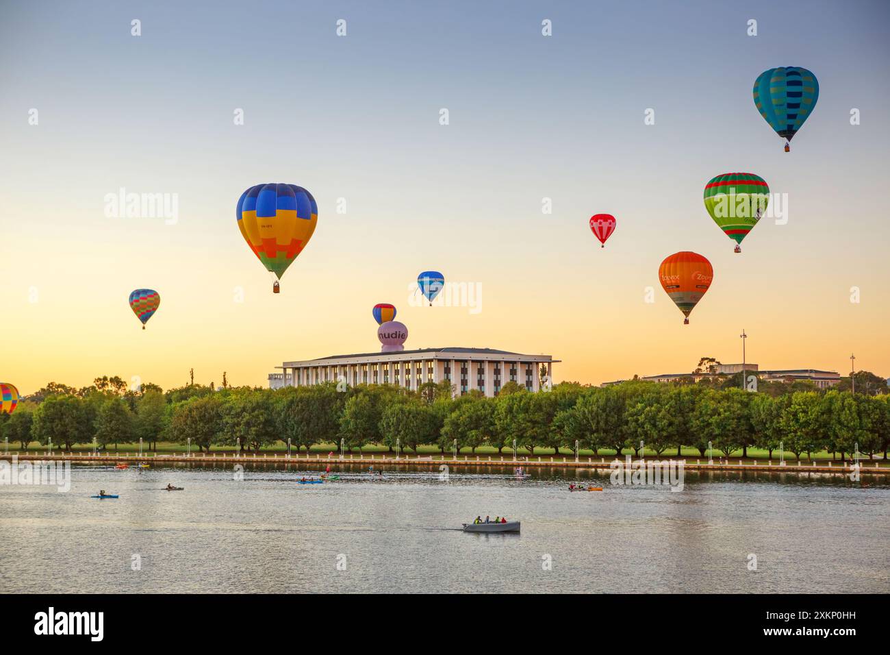 Hot air balloons float over the National Library of Australia during ...