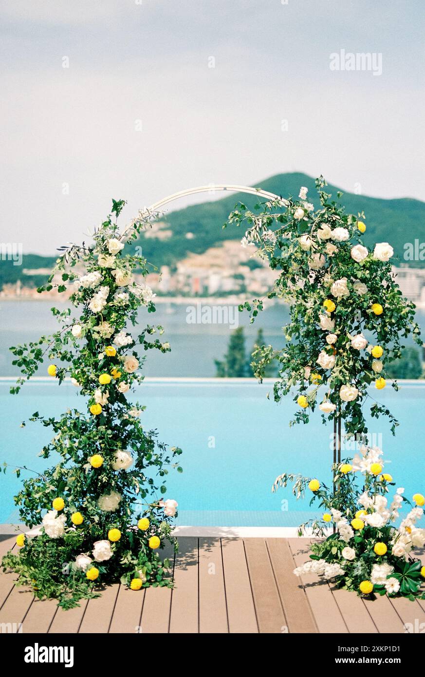 Wedding arch stands on the shore of the pool Stock Photo - Alamy