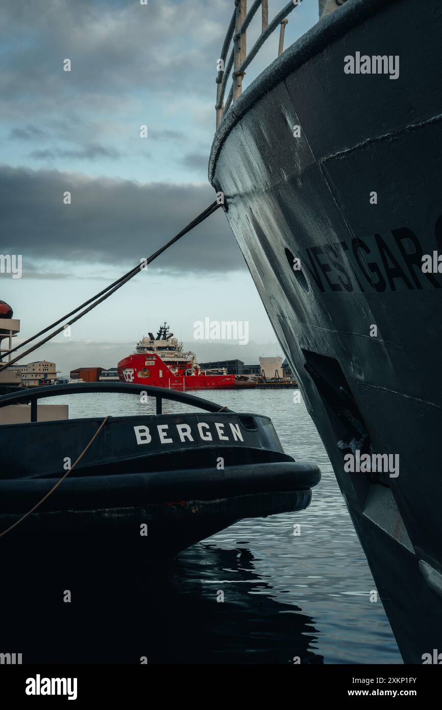The name bergen is displayed on the side of a boat, floating on the water. The boat moves across ...
