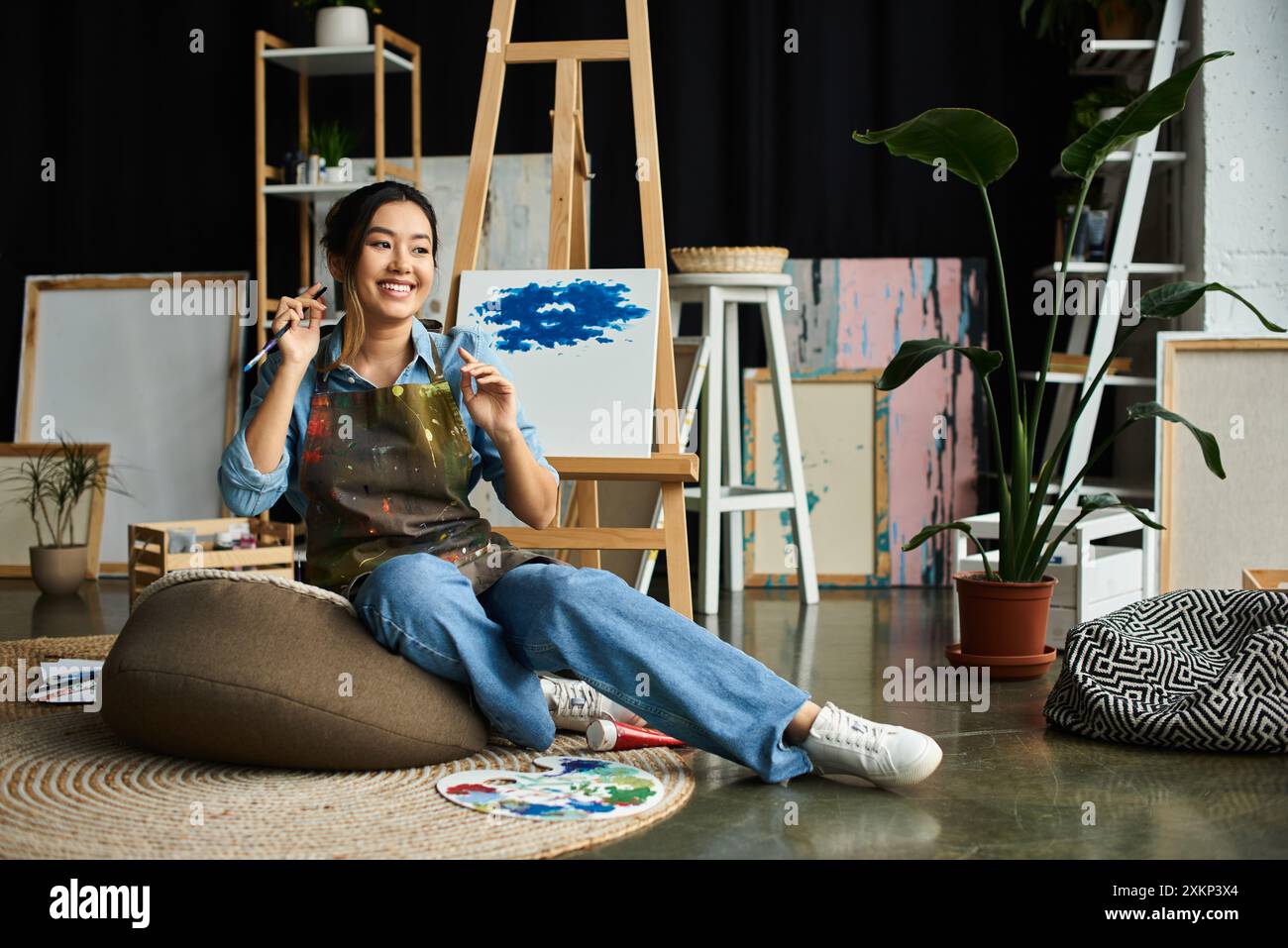 Asian artist painting sitting on hi-res stock photography and images ...