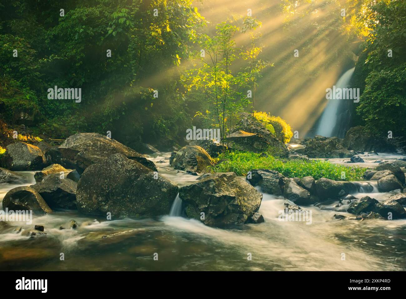 morning view of water flow in cool waterfall and sunrise Stock Photo ...
