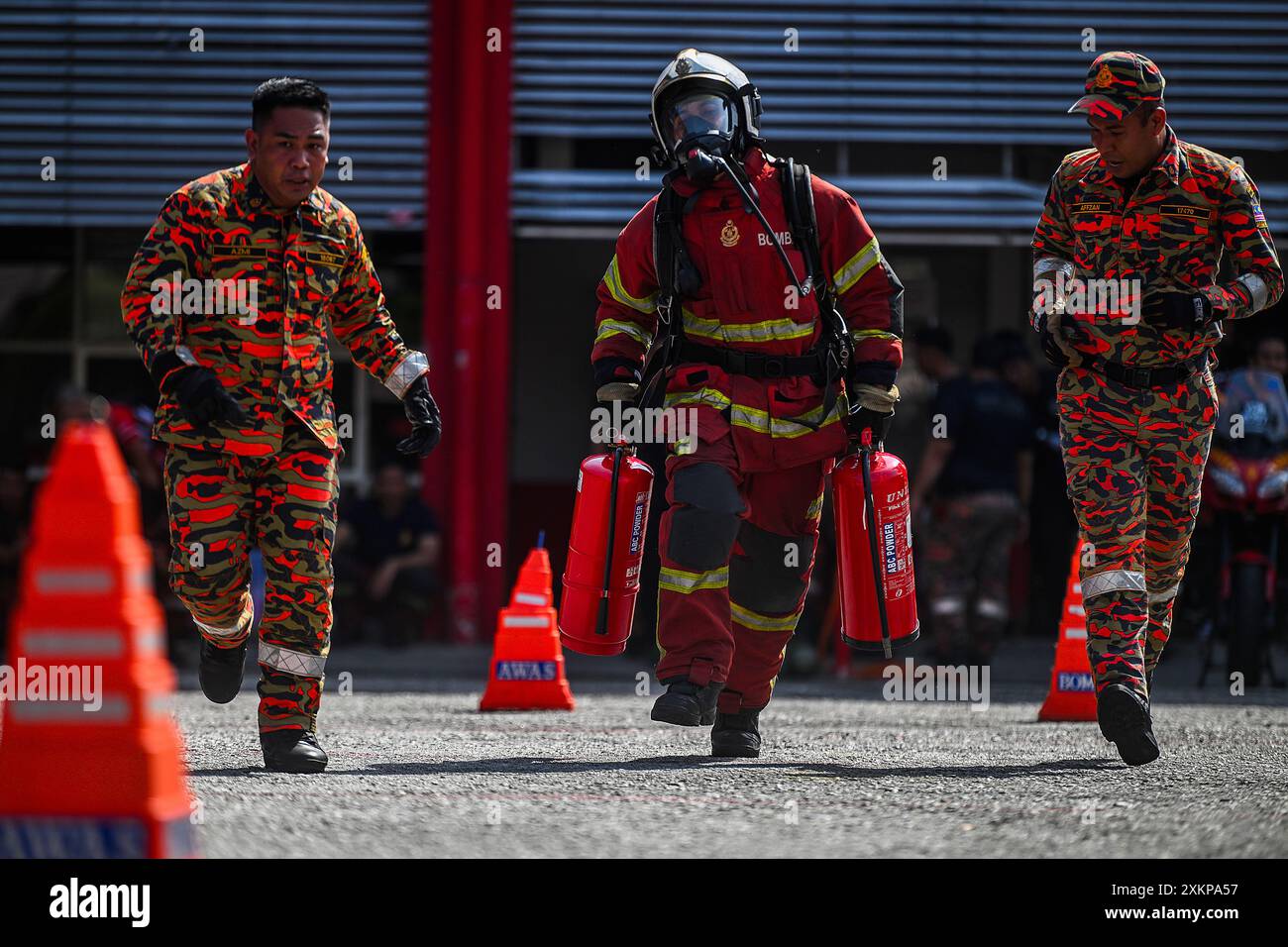 Kuala Lumpur, Malaysia. 29th May, 2024. A firefighter carrying fire ...