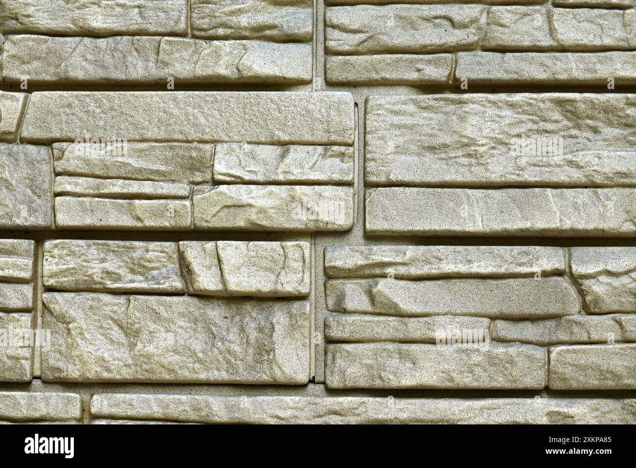Close up front view of wall covered from finishing beige decorative ...