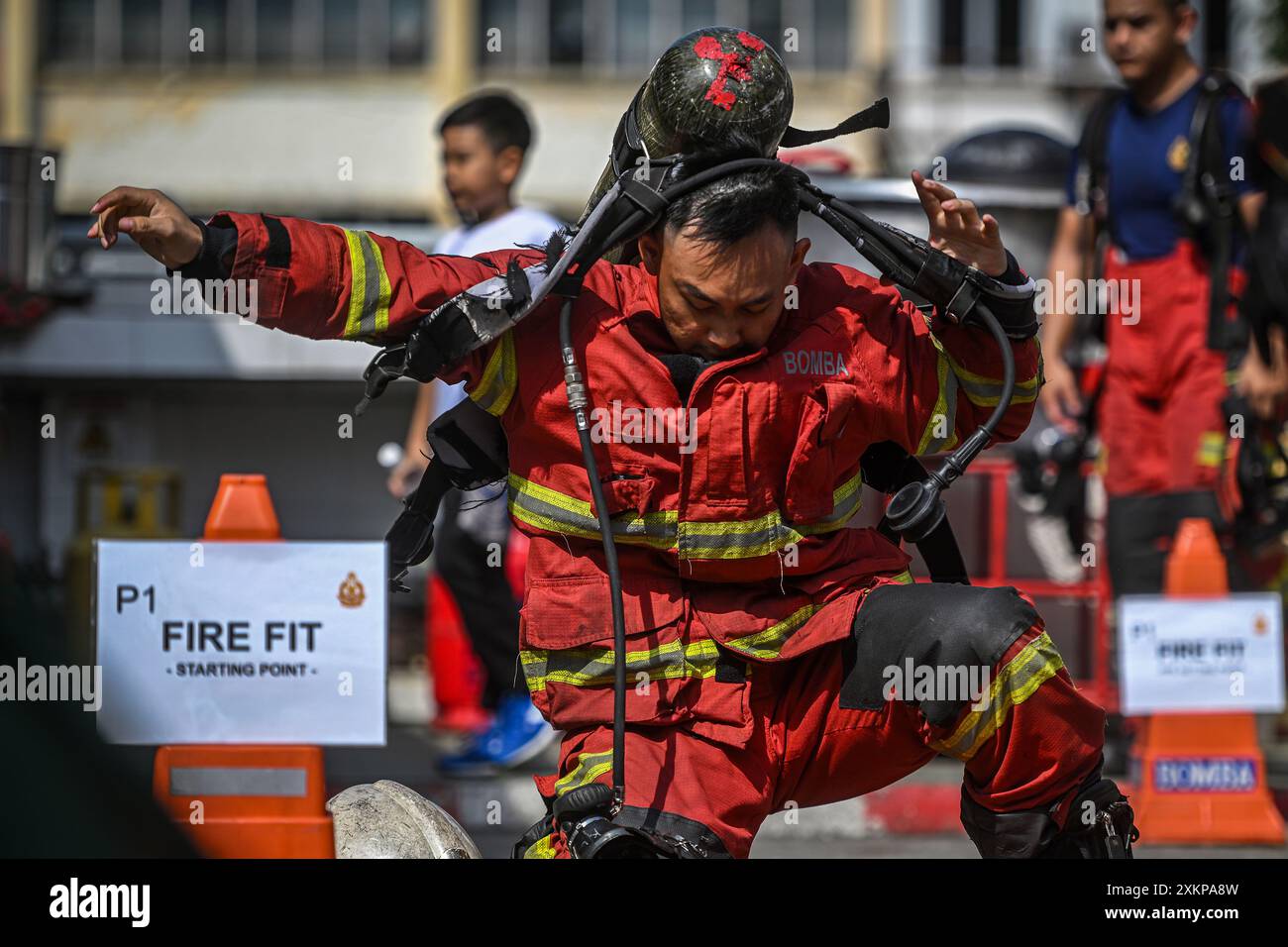 Kuala Lumpur, Malaysia. 29th May, 2024. A firefighter puts on a ...