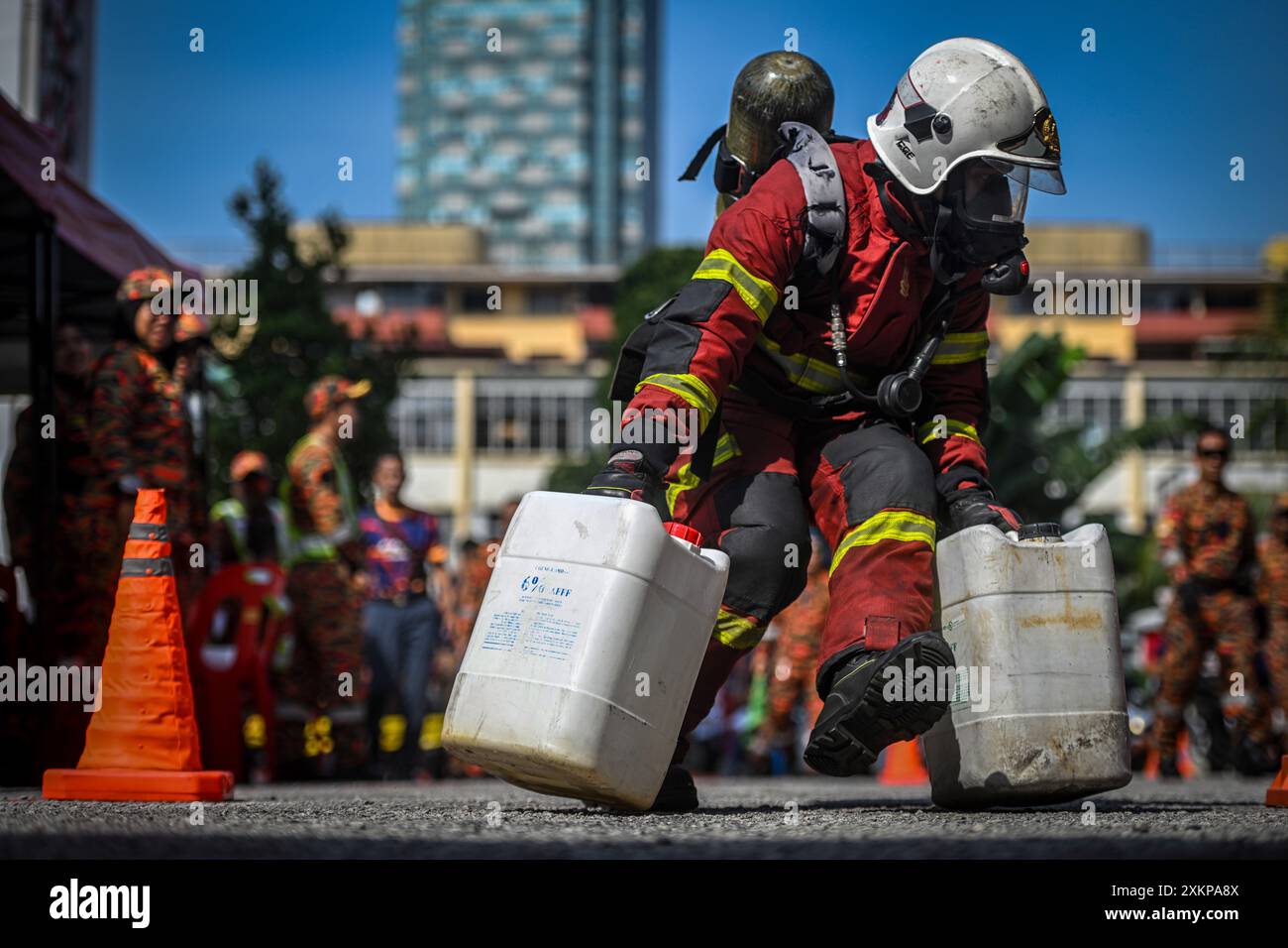 Kuala Lumpur, Malaysia. 29th May, 2024. A firefighter carrying ...