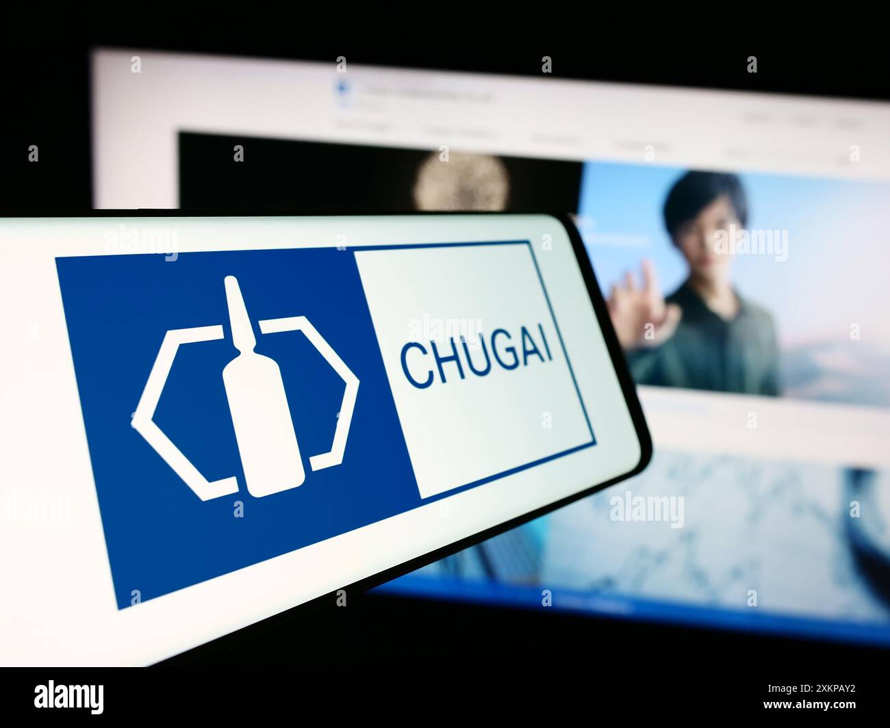 Mobile phone with logo of Japanese company Chugai Pharmaceutical Co ...