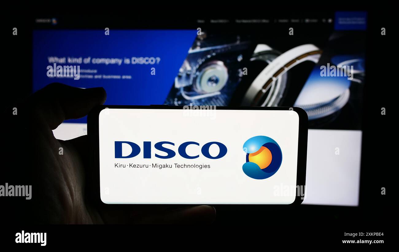 Person holding cellphone with logo of Japanese precision tools company ...