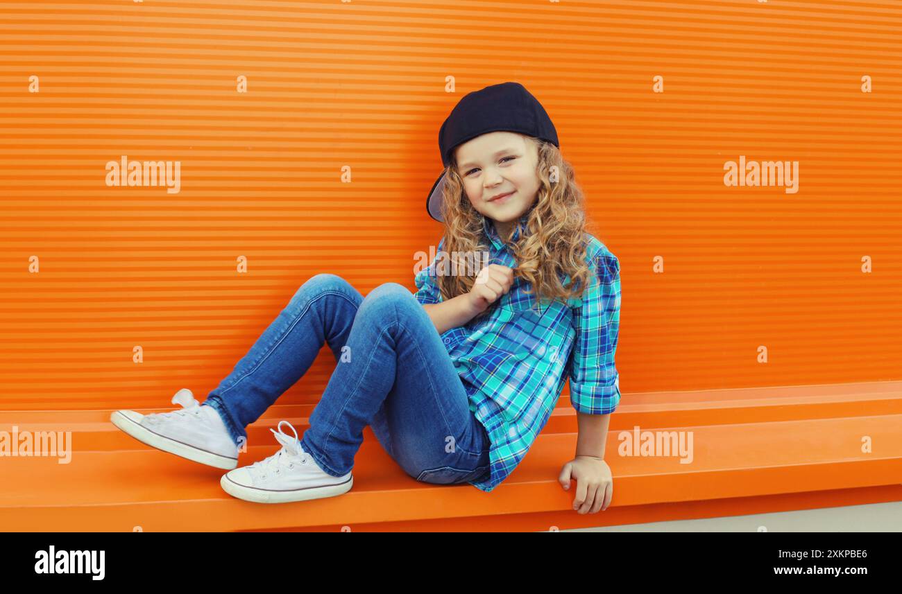 Happy cheerful kid girl dancer with curly hair, joyful little child ...