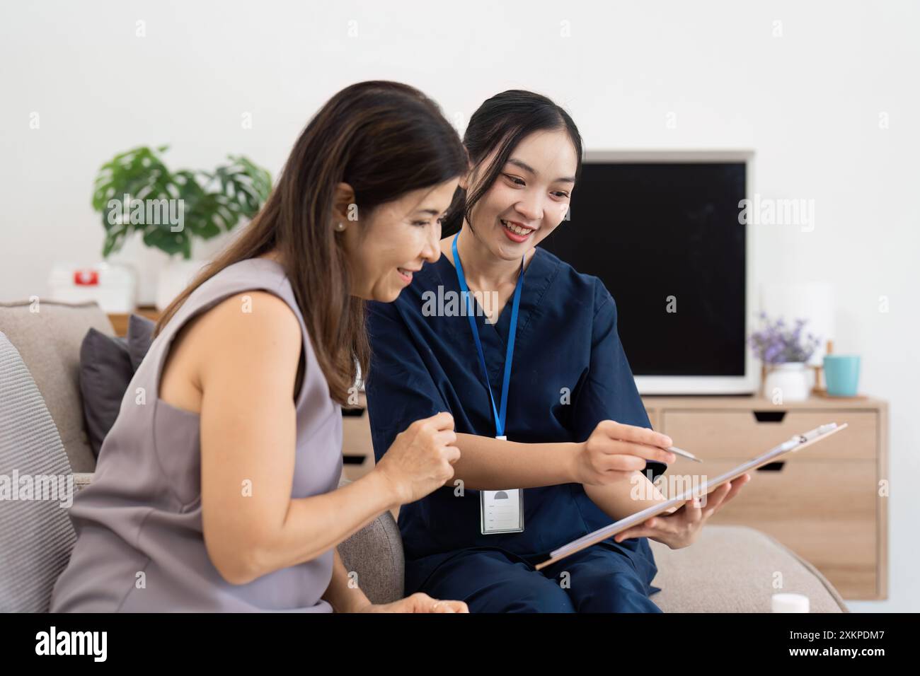 Healthcare Professional Providing In-Home Care and Consultation to a ...