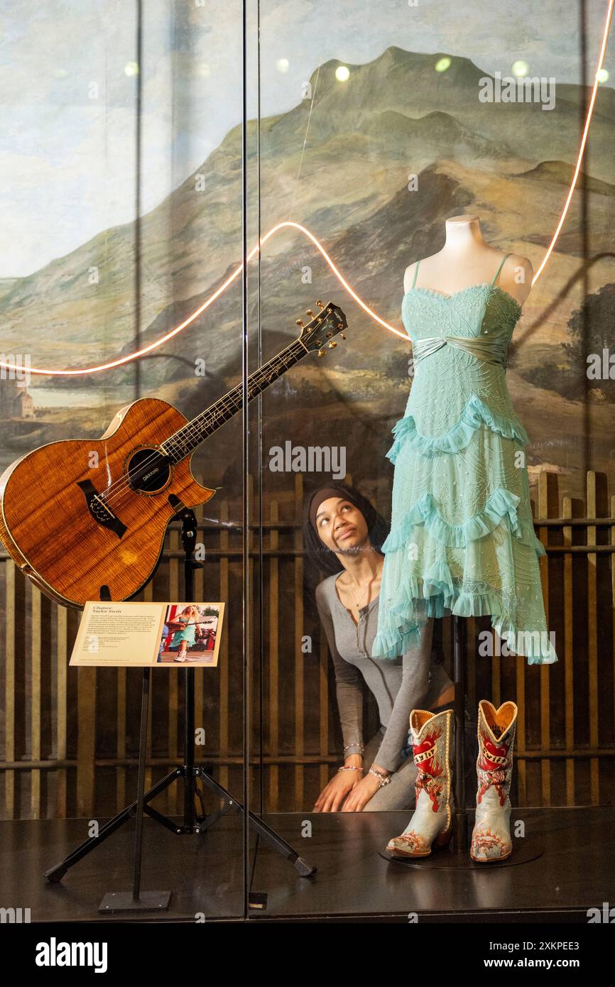 London, UK. 24 July 2024. 'Dress and customised cowboy boots worn by ...