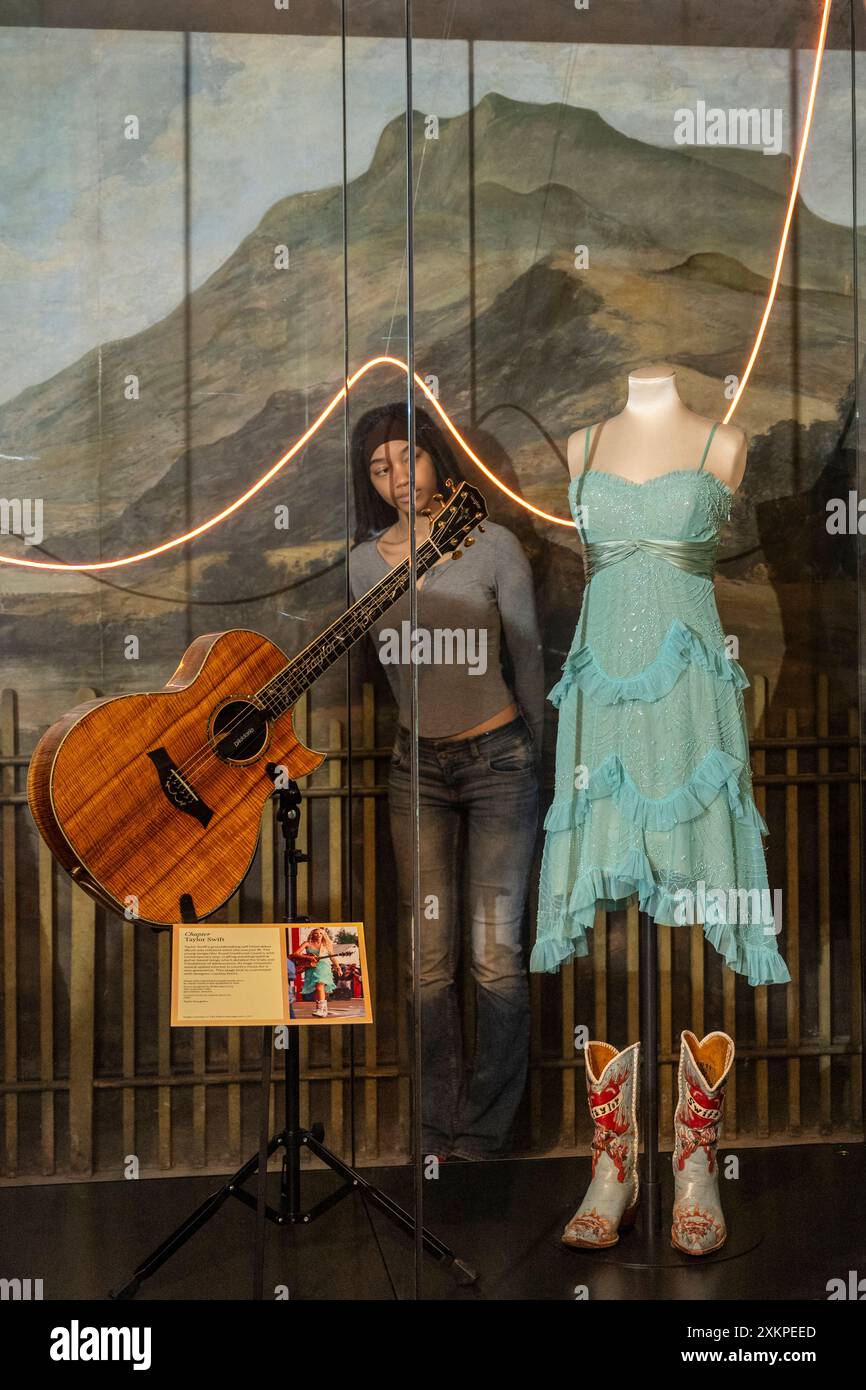 London, UK. 24 July 2024. 'Dress and customised cowboy boots worn by ...