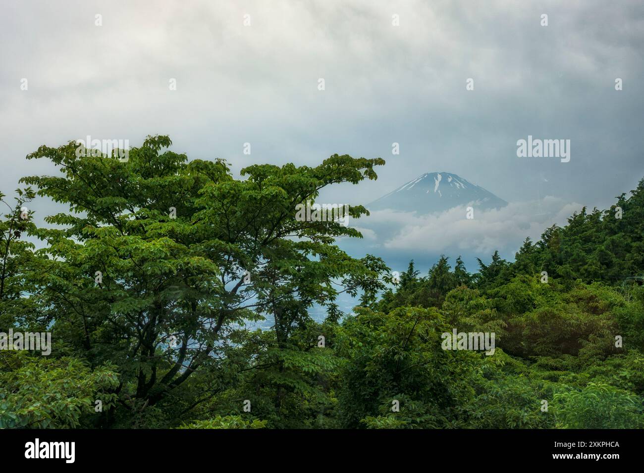 Mount Fuji, seen here during a cloudy day, from a distance with ...