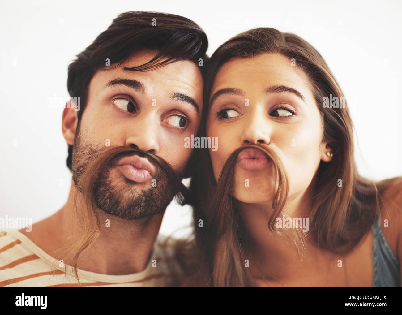 Couple, house and hair mustache with pout, fun and kissing face with ...