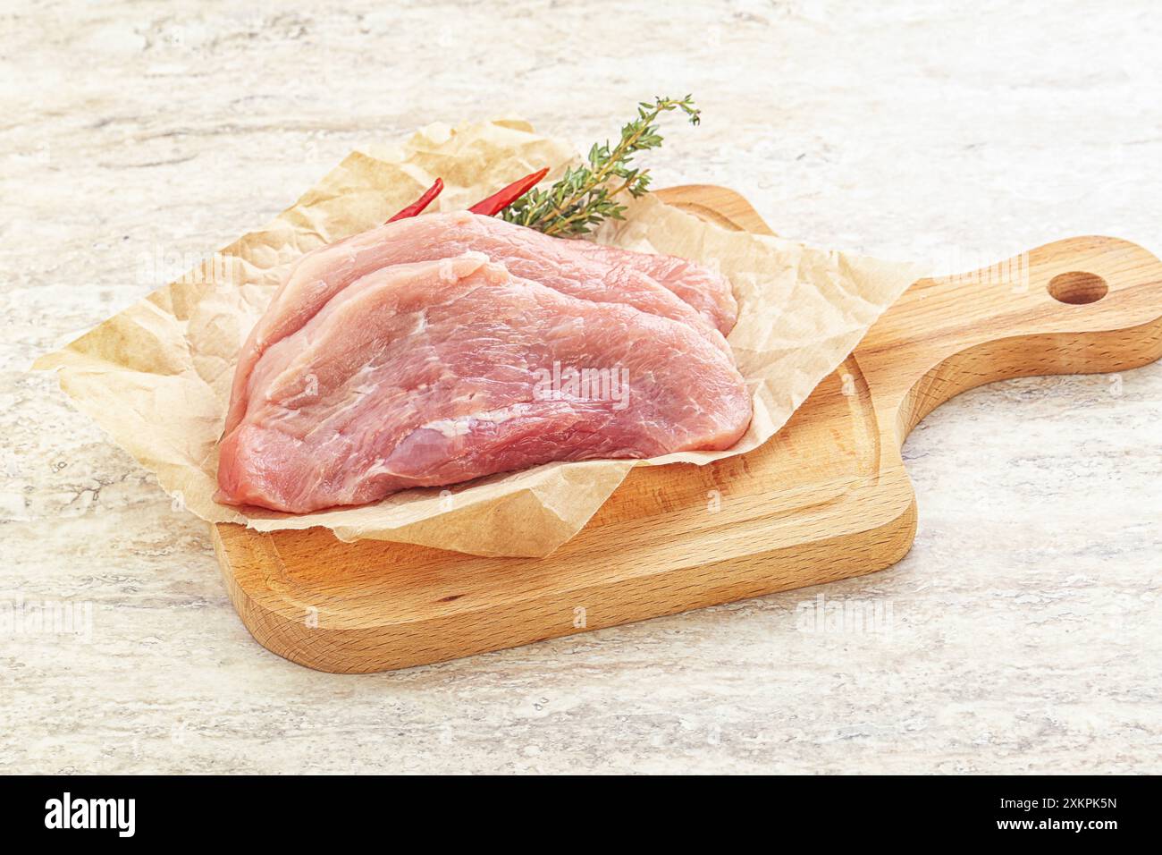 Raw pork schnitzel cut for roast Stock Photo - Alamy