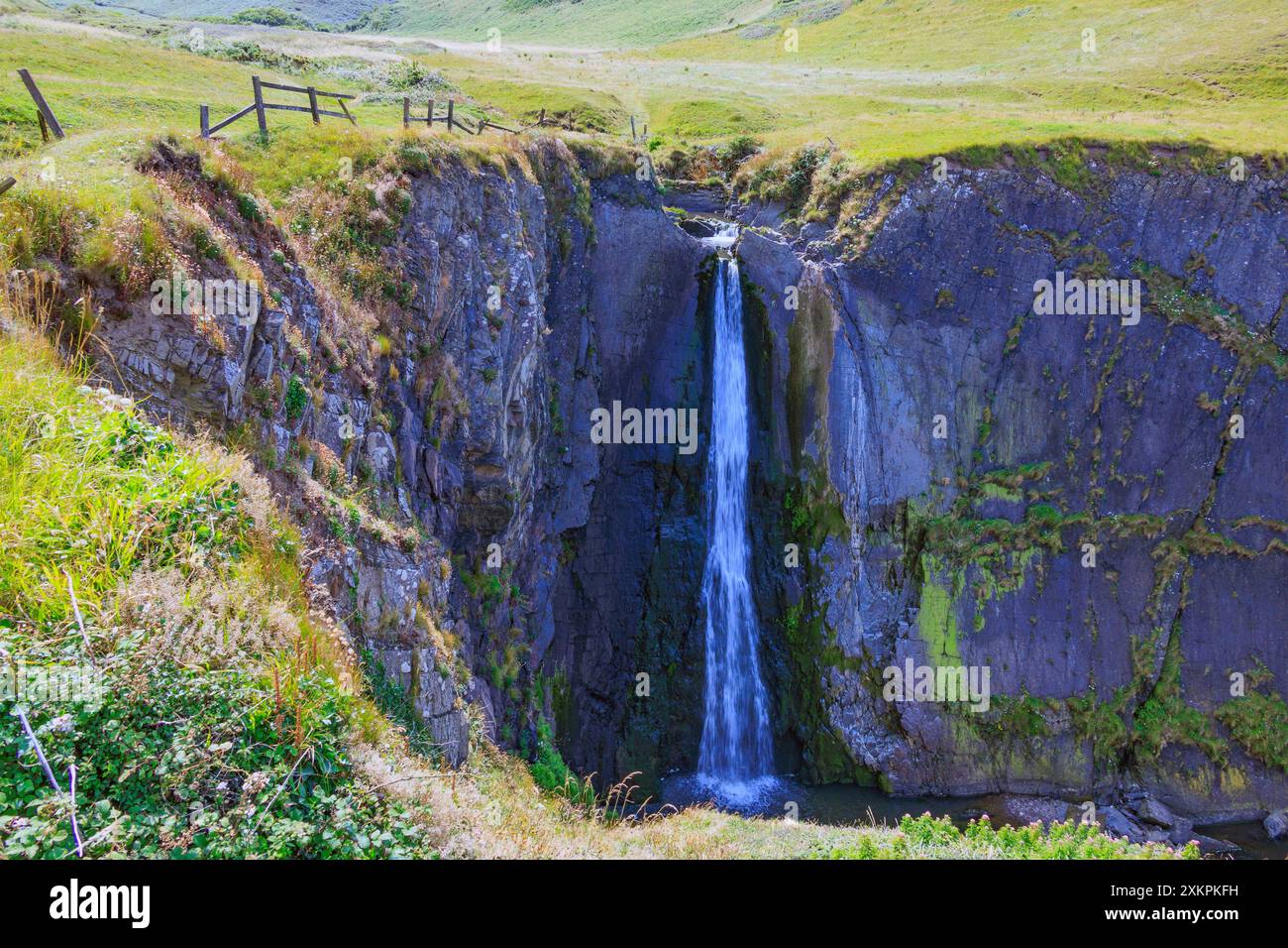 The dramatic waterfall at Speke's Mill Mouth on the SW Coast Path near ...