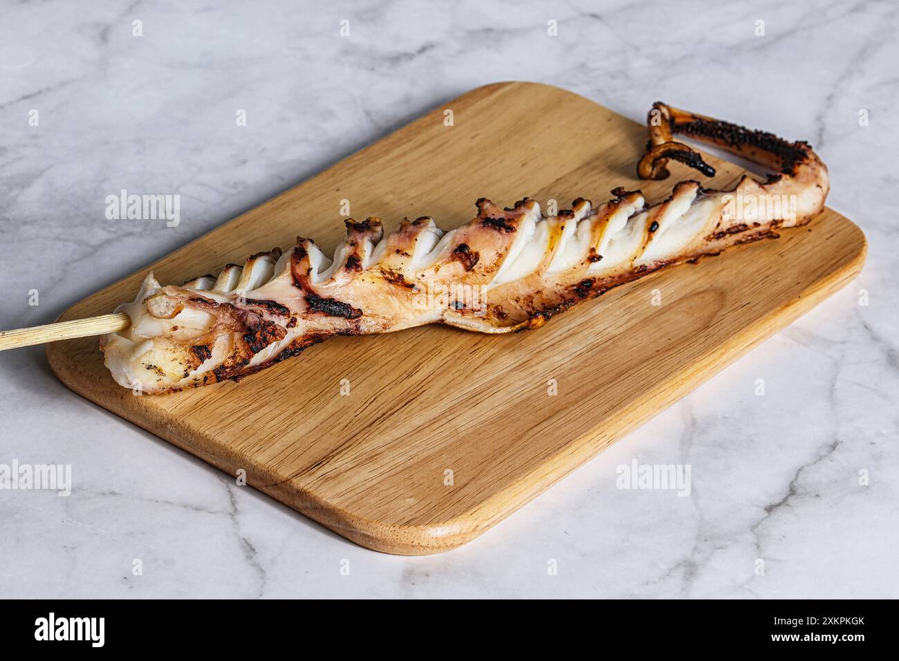 Delicous tasty Grilled octopus tentacle snack Stock Photo - Alamy