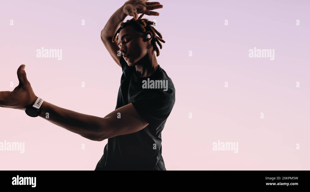 Male dancer with expressive moves and a vibrant energy dances in a ...