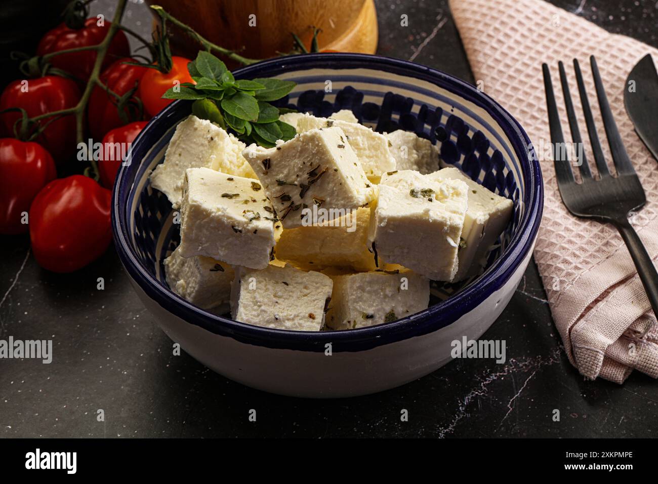 Greek traditional Feta cheese cubes with herbs and spices Stock Photo ...
