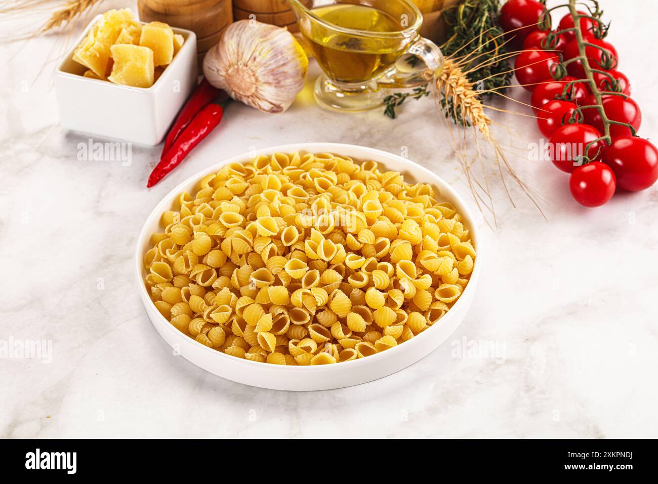 Italian cuisine - dry conchiglie shell pasta Stock Photo - Alamy