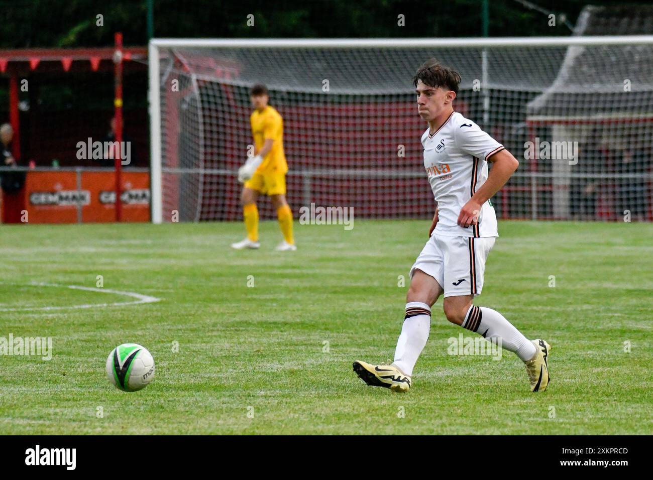 Briton Ferry, Wales. 23 July 2024. Harlan Perry of Swansea City passing ...