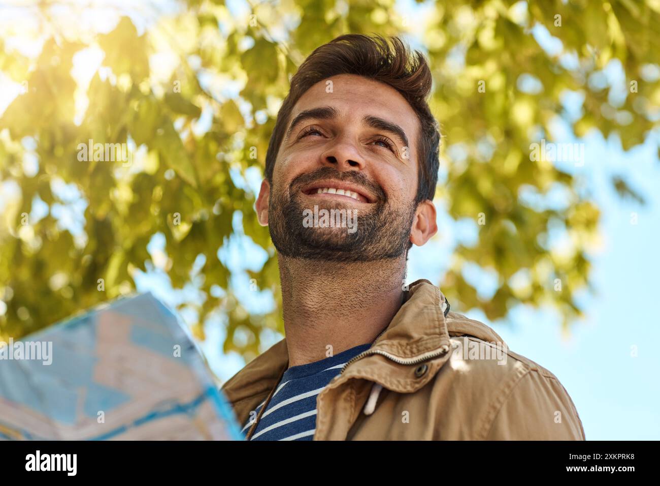 Happy man, tourist map and city sightseeing in outdoor and urban ...