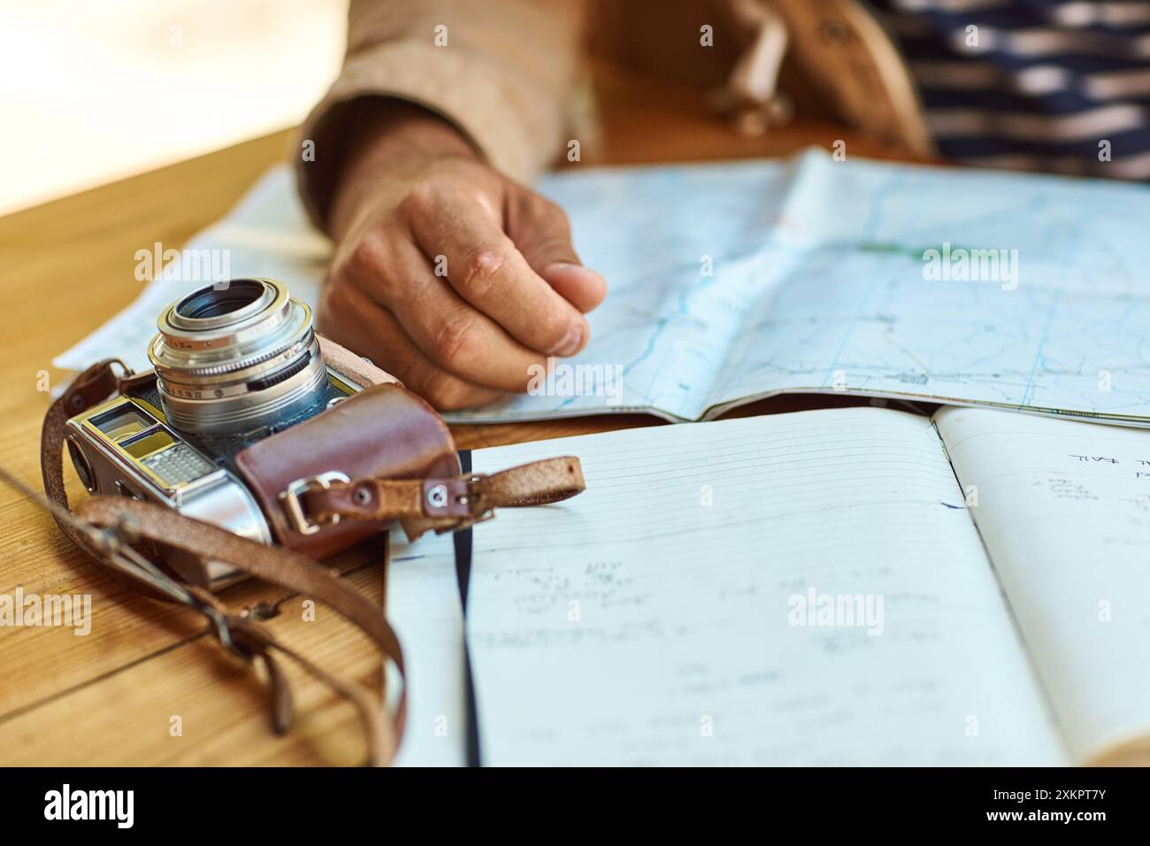 Travel, hand and notebook with map for planning journey, destination ...
