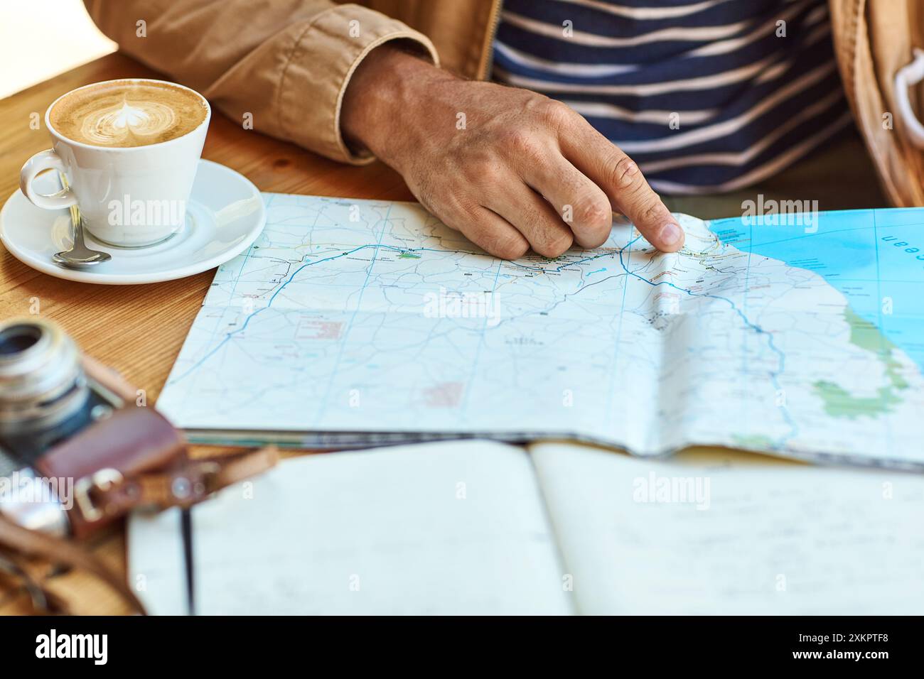 Travel, coffee and hand with map for planning journey, destination ...