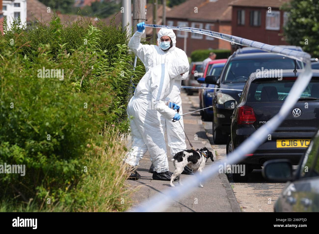 Forensic officers on Mooring Road, Rochester in Kent, where a moped was ...
