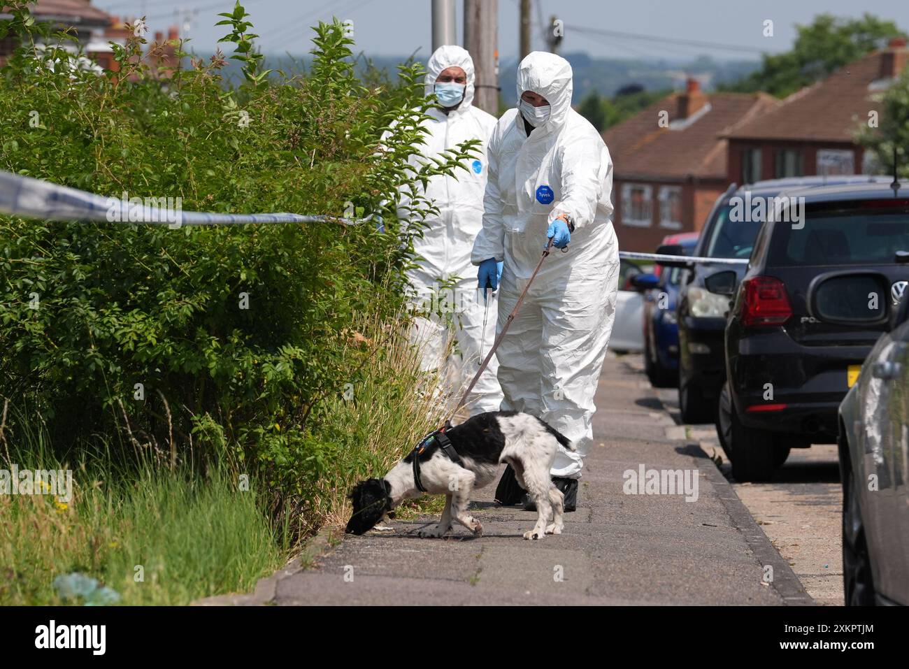 Forensic officers on Mooring Road, Rochester in Kent, where a moped was ...