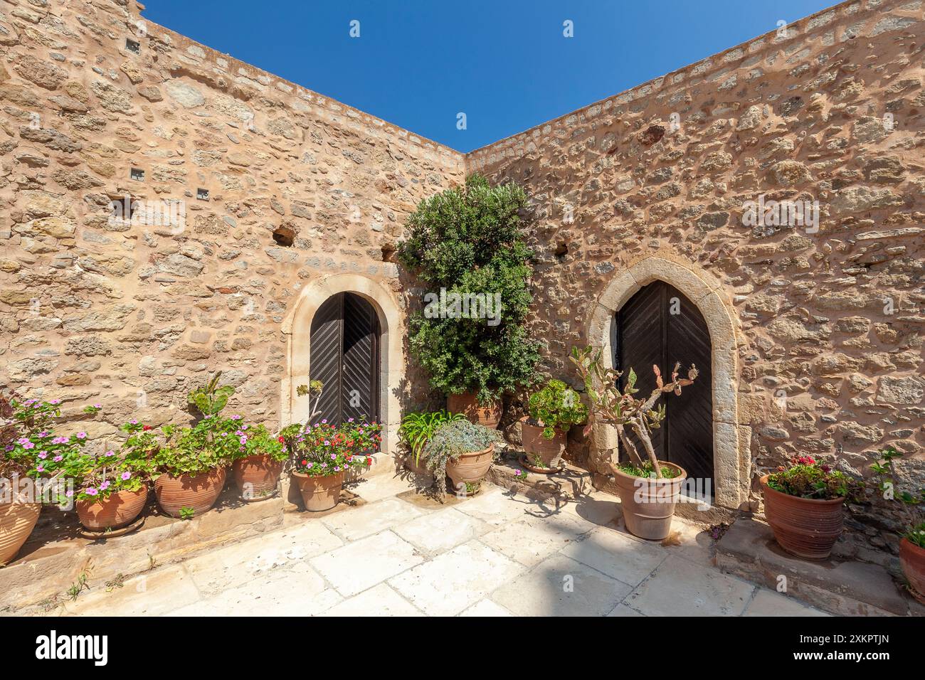 Charming courtyard at the Moni Toplou Monastery in Sitia, Crete ...
