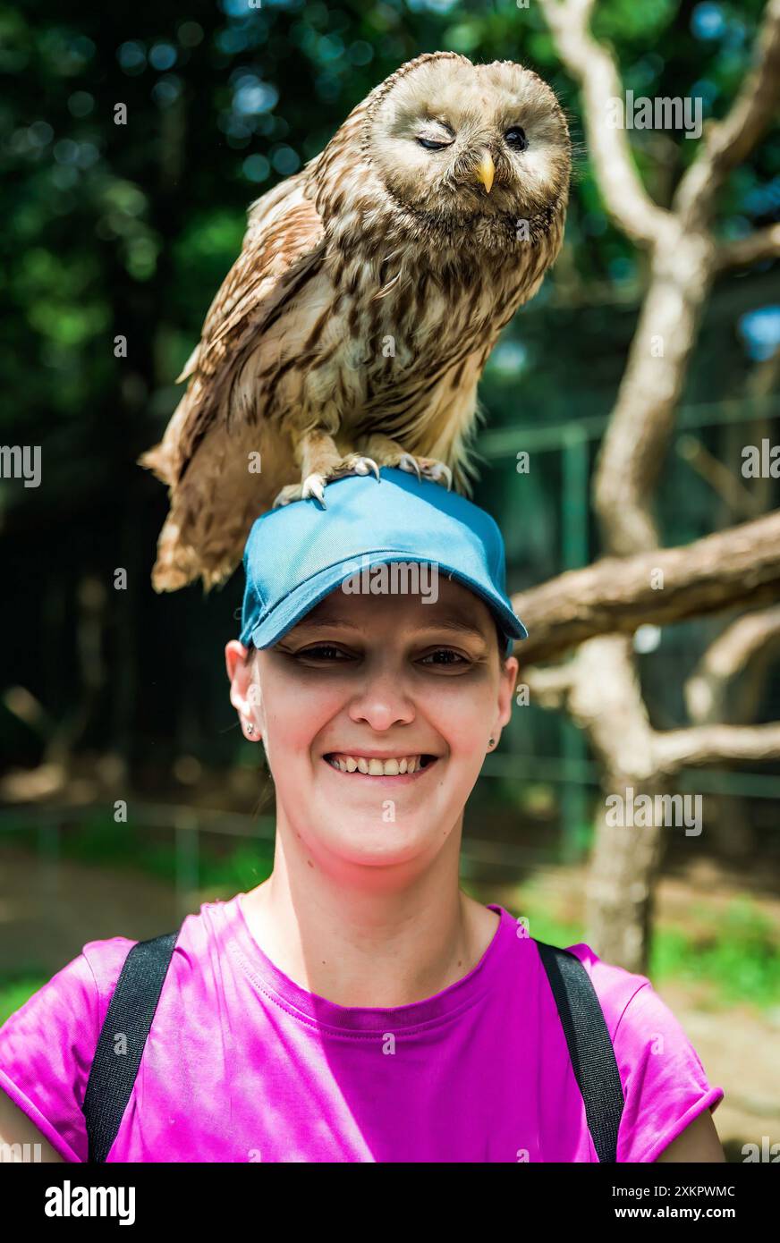 Portrait of laughing 36 years old Russian woman with Ural owl (Strix ...