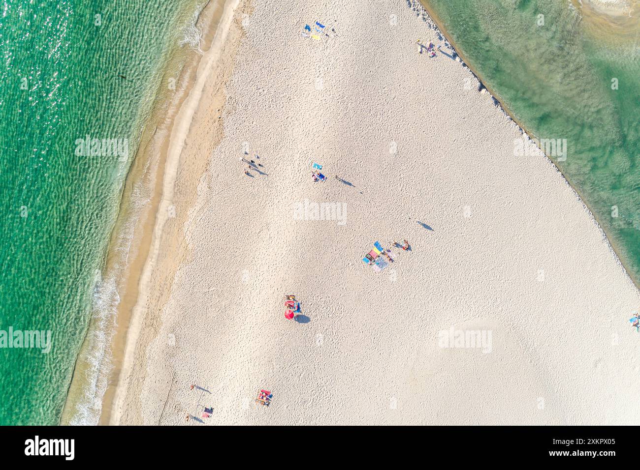 people enjoying the beach in summer, aerial overhead view with a drone ...