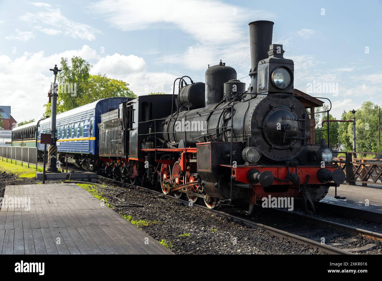 Vintage passenger train with black steam locomotive is on Sortavala ...