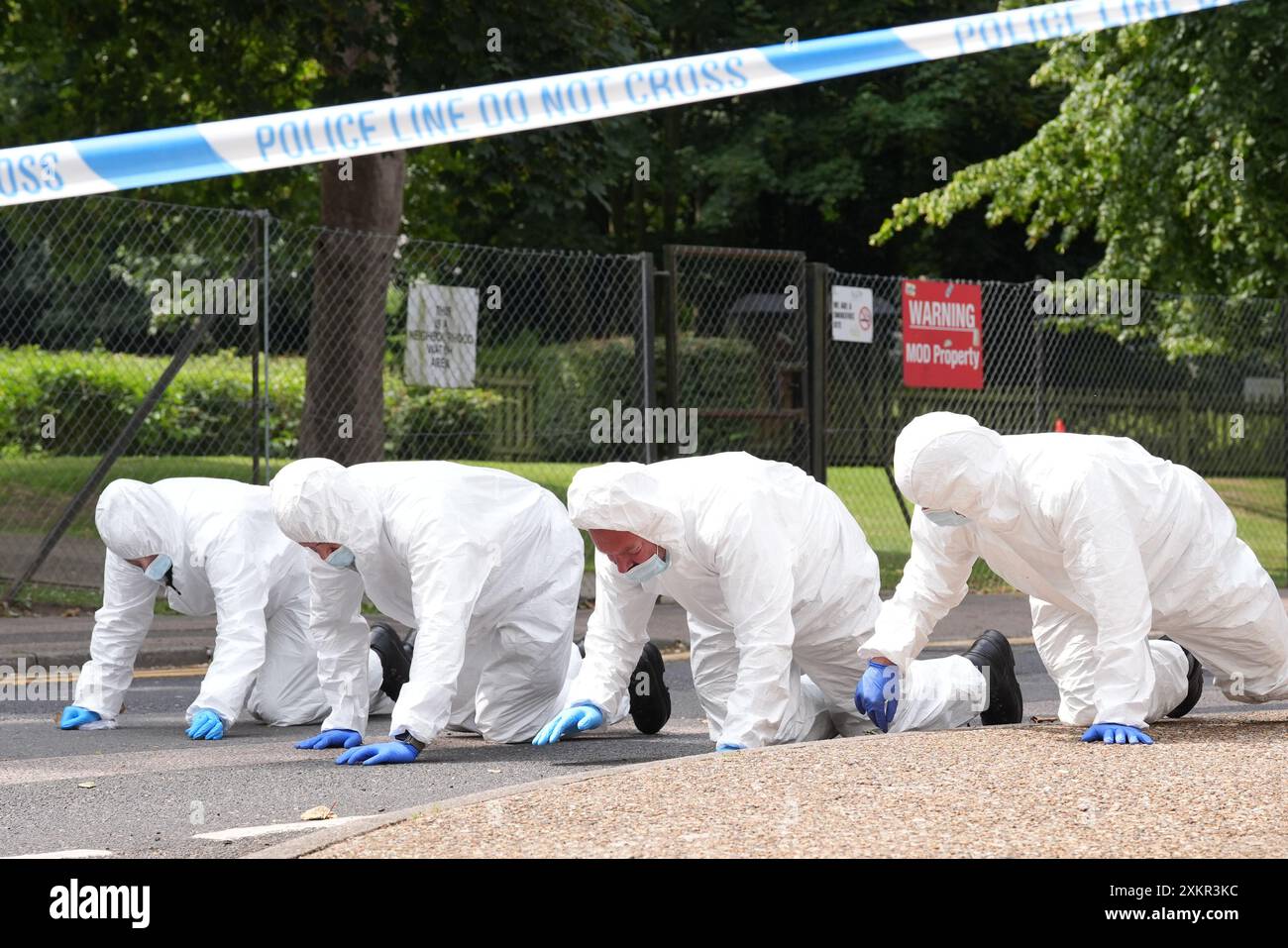 Forensic officers search near the scene at Sally Port in Gillingham ...