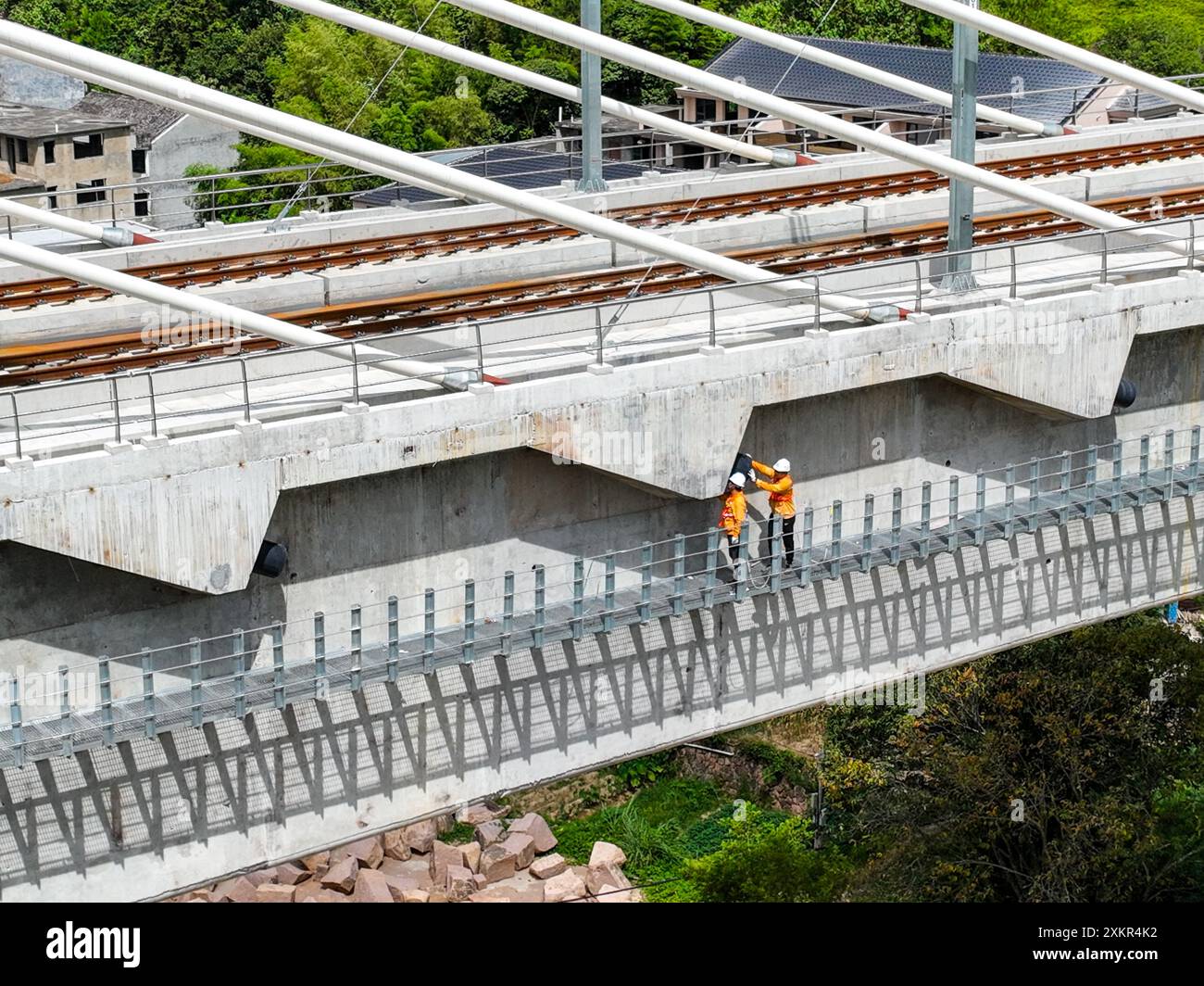 Wenzhou. 24th July, 2024. A drone photo shows railway workers ...