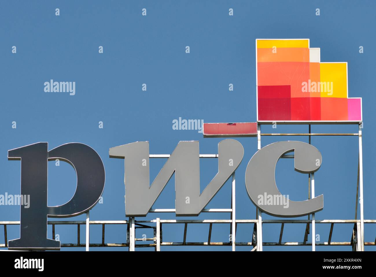 PricewaterhouseCoopers or PWC logo and sign on office building in ...