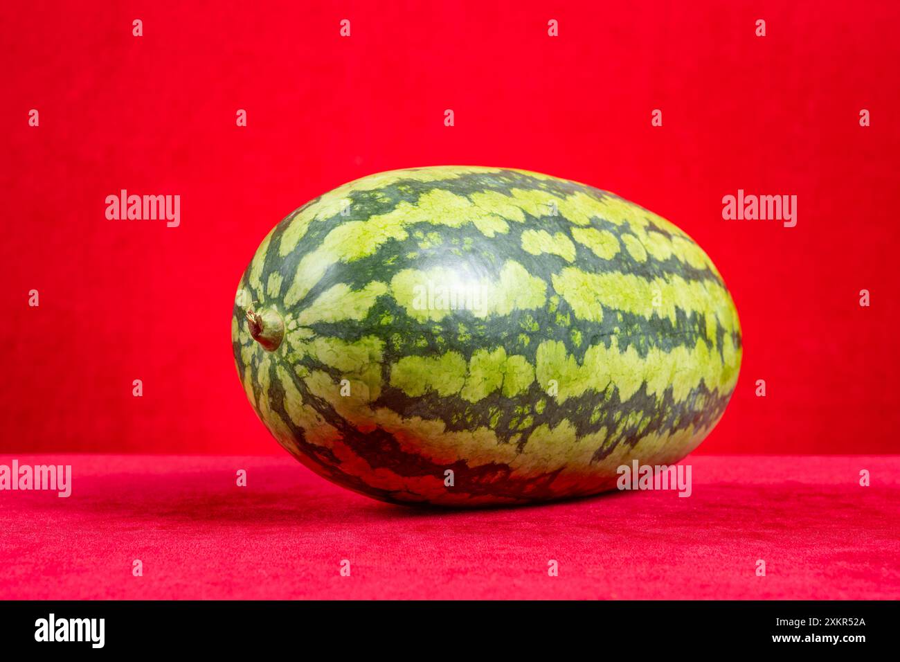 fresh watermelon on red horizontal composition Stock Photo - Alamy