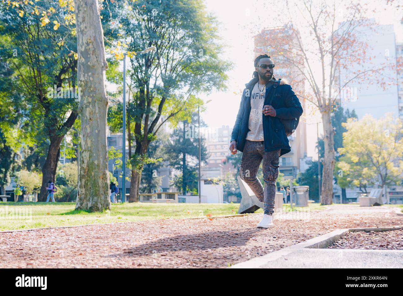 African man walking park looking hi-res stock photography and images ...