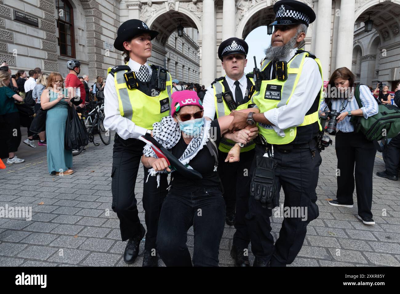 London, UK. 24 July, 2024. An activist is arrested as police attempt to ...