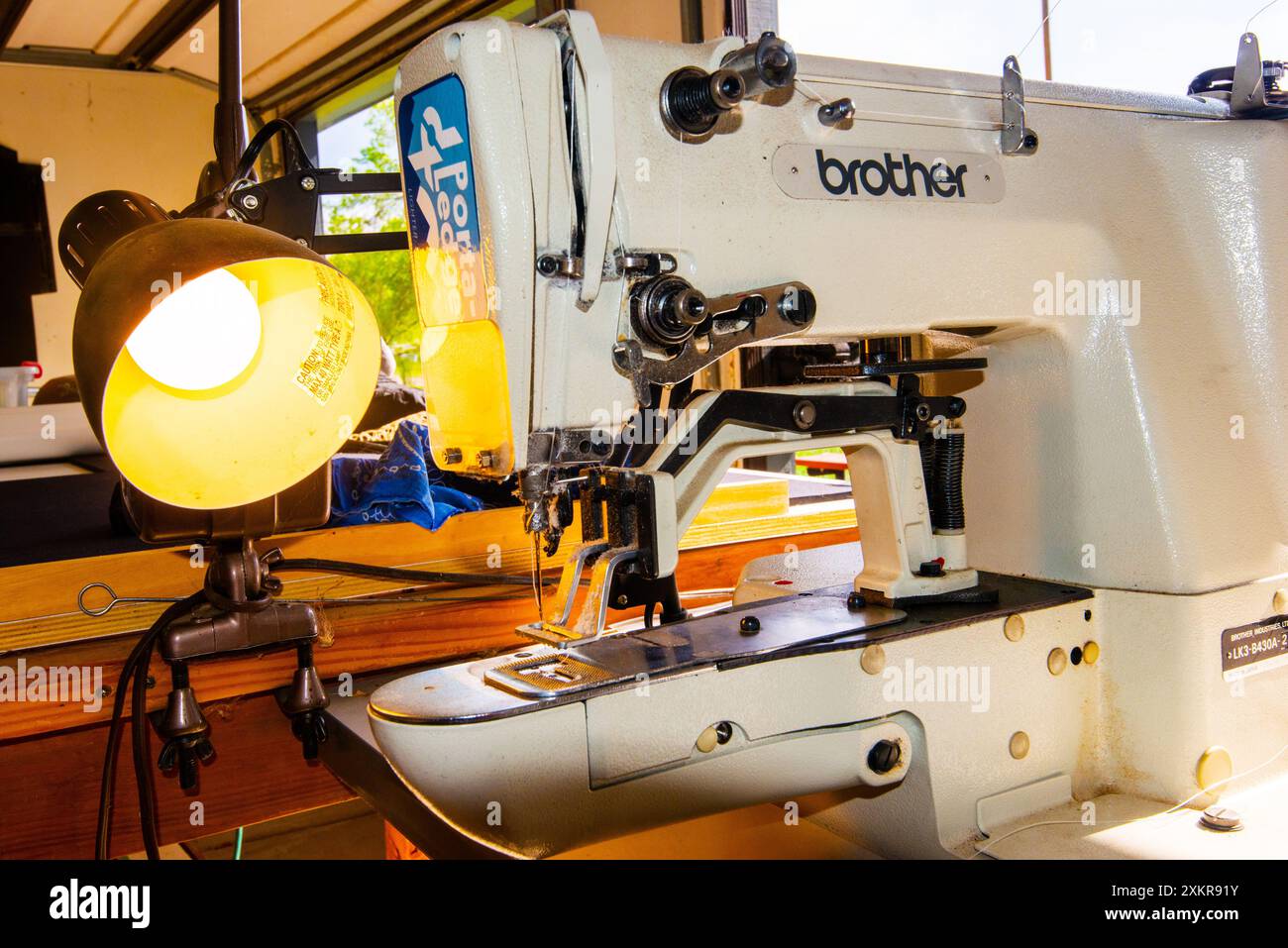 A brother industrial sewing machine is ready to sew heavy fabric in a ...